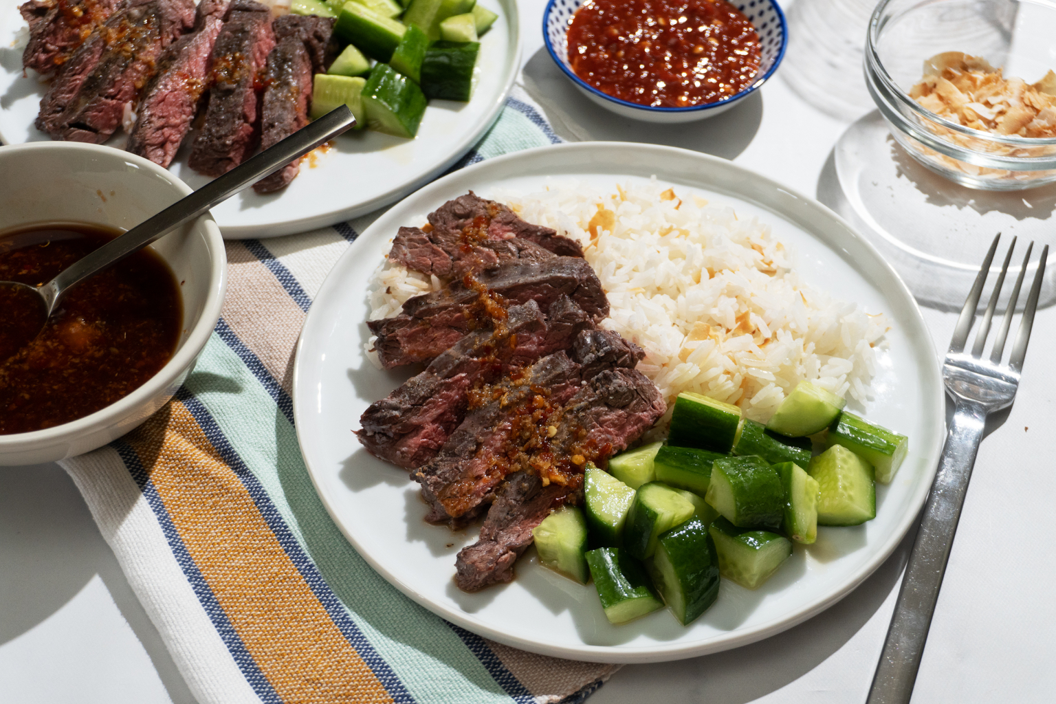 Sambal Steak with Coconut Rice and Cucumber Salad – Recette Magazine